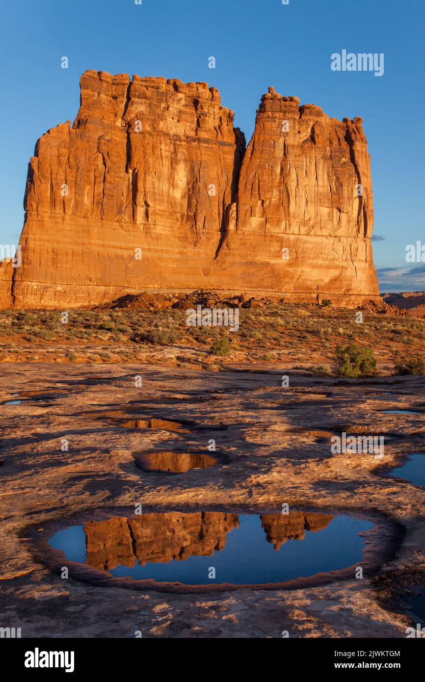 The Organ, a sandstone monolith in the Courthouse Towers, reflected in ...