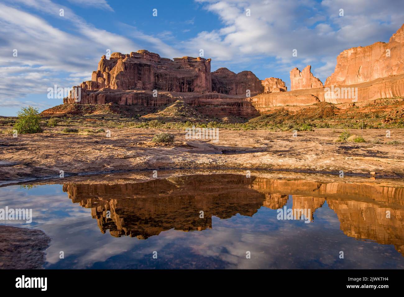 The east wall of the Park Avenue formations reflected in rain-filled ...