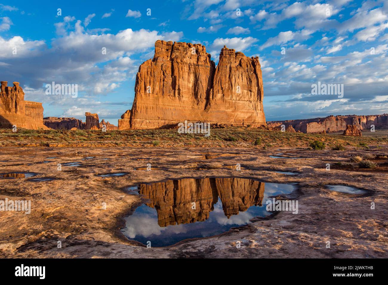 The Organ, a sandstone monolith in the Courthouse Towers, reflected in ...