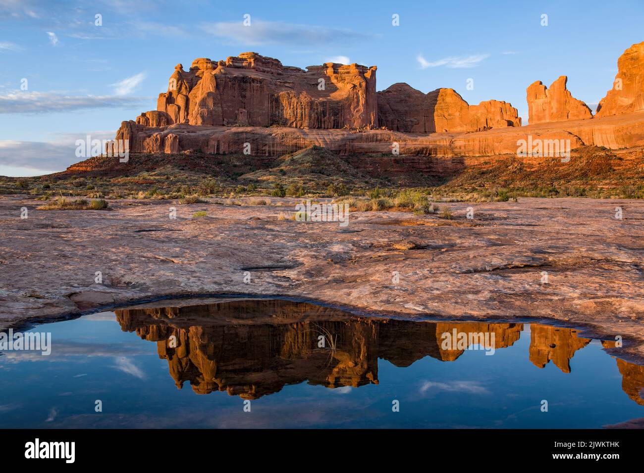 The east wall of the Park Avenue formations reflected in rain-filled ...