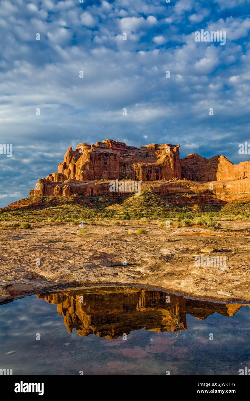 The east wall of the Park Avenue formations reflected in rain-filled ...