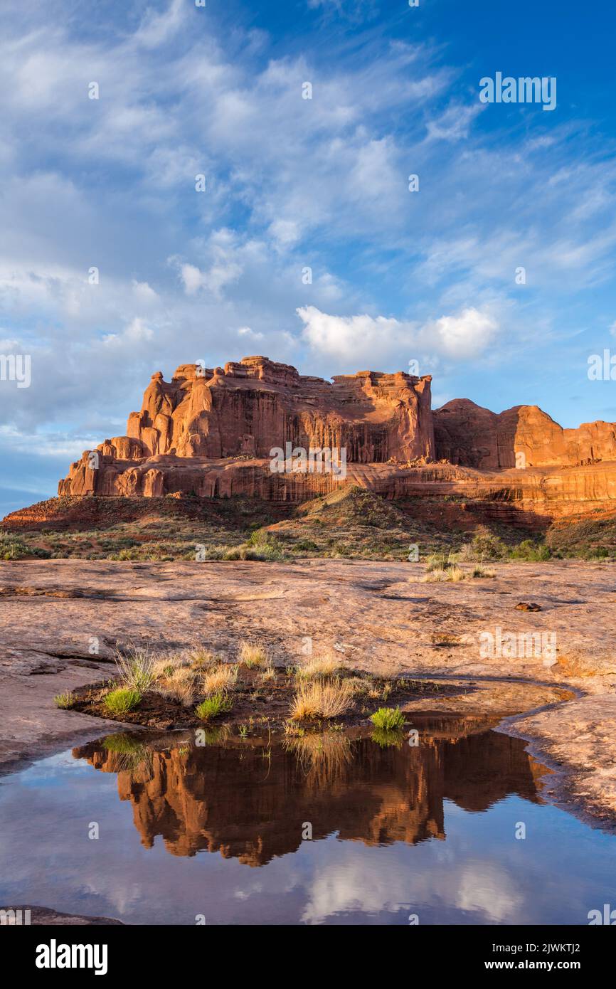 The east wall of the Park Avenue formations reflected in rain-filled ...