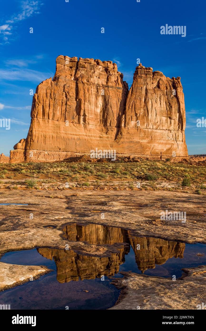 The Organ, a sandstone monolith in the Courthouse Towers, reflected in ...