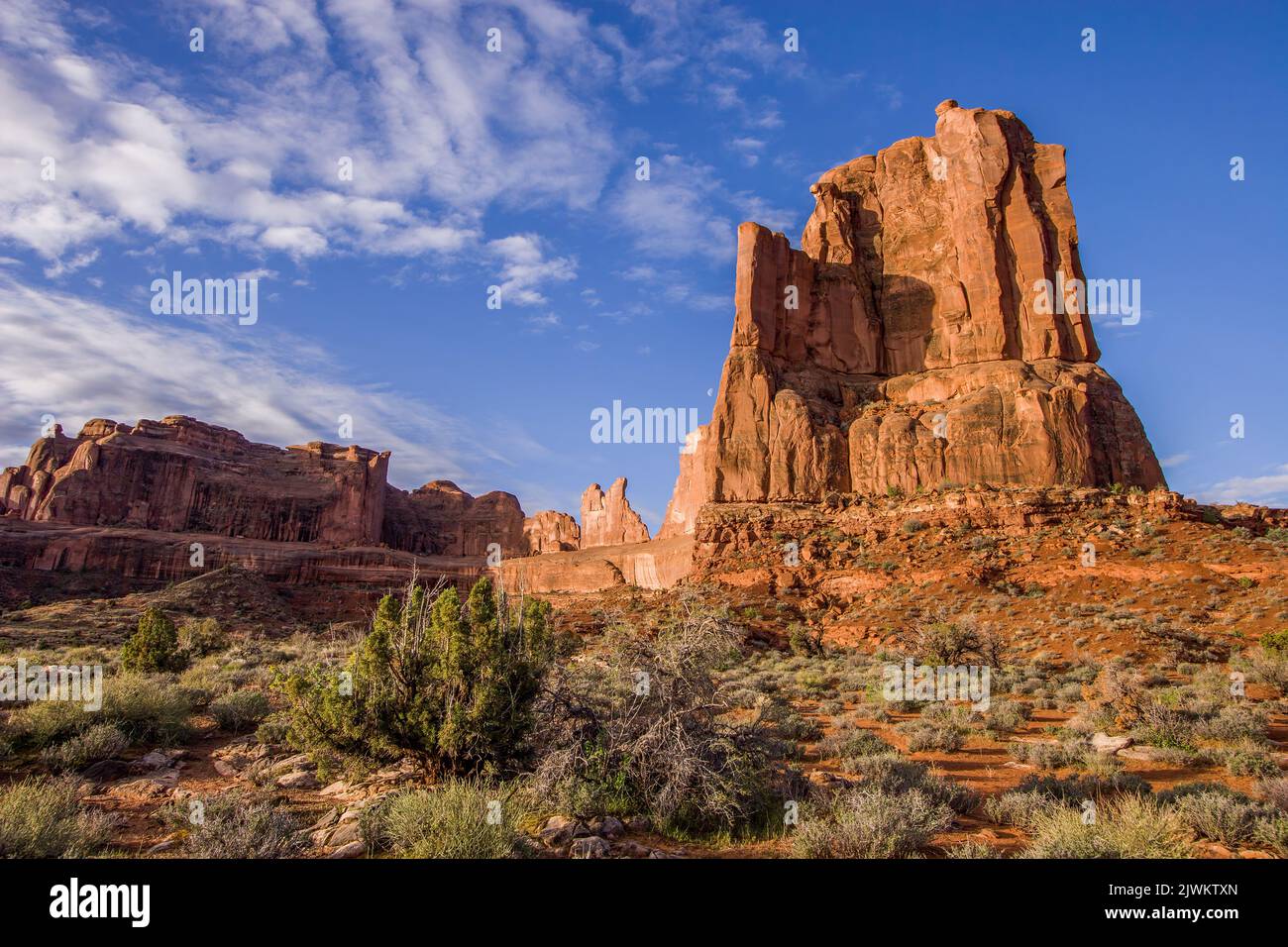 A sandstone monolith in Courthouse Towers with Park Avenue behind in ...