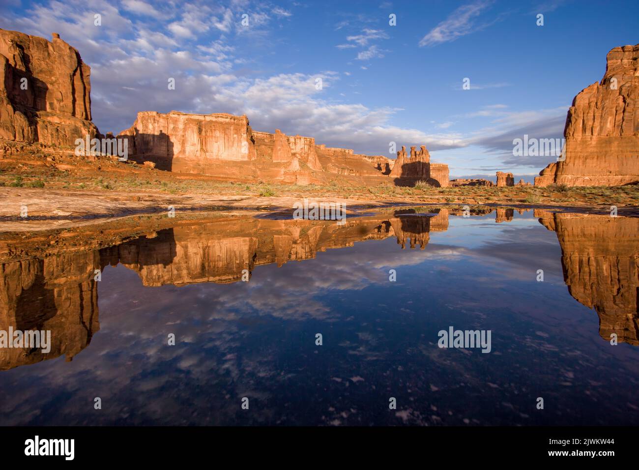 The Courthouse Towers reflected in an ephemeral rainwater pool in ...