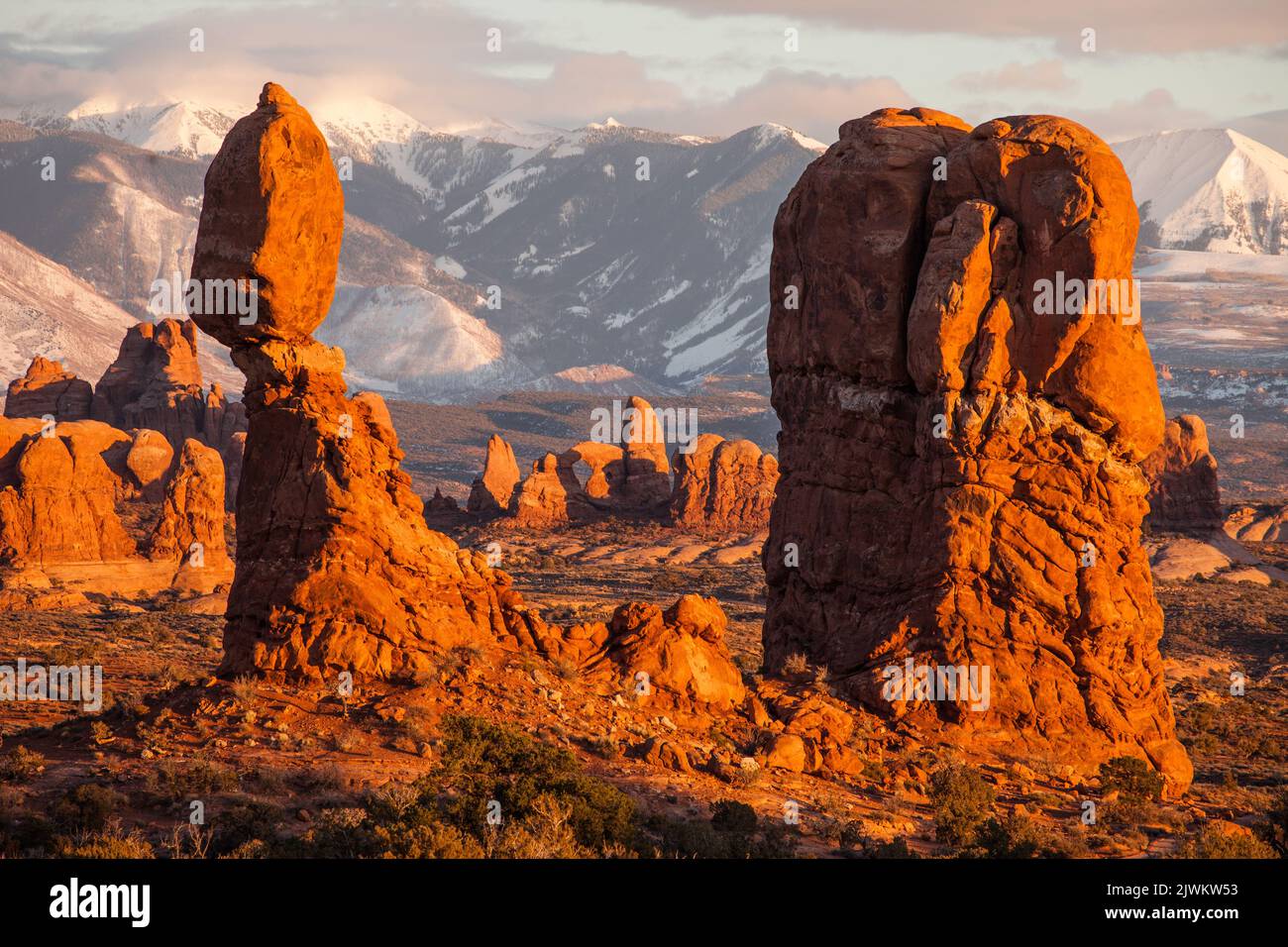 A telephoto view of Balanced Rock with Turret Arch and the La Sal ...