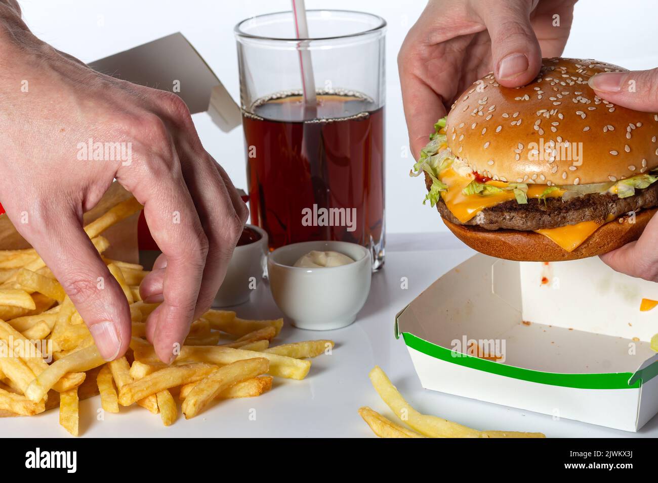 Fast food or junk food for a quick snack. soft sesame seed bun, juicy ...
