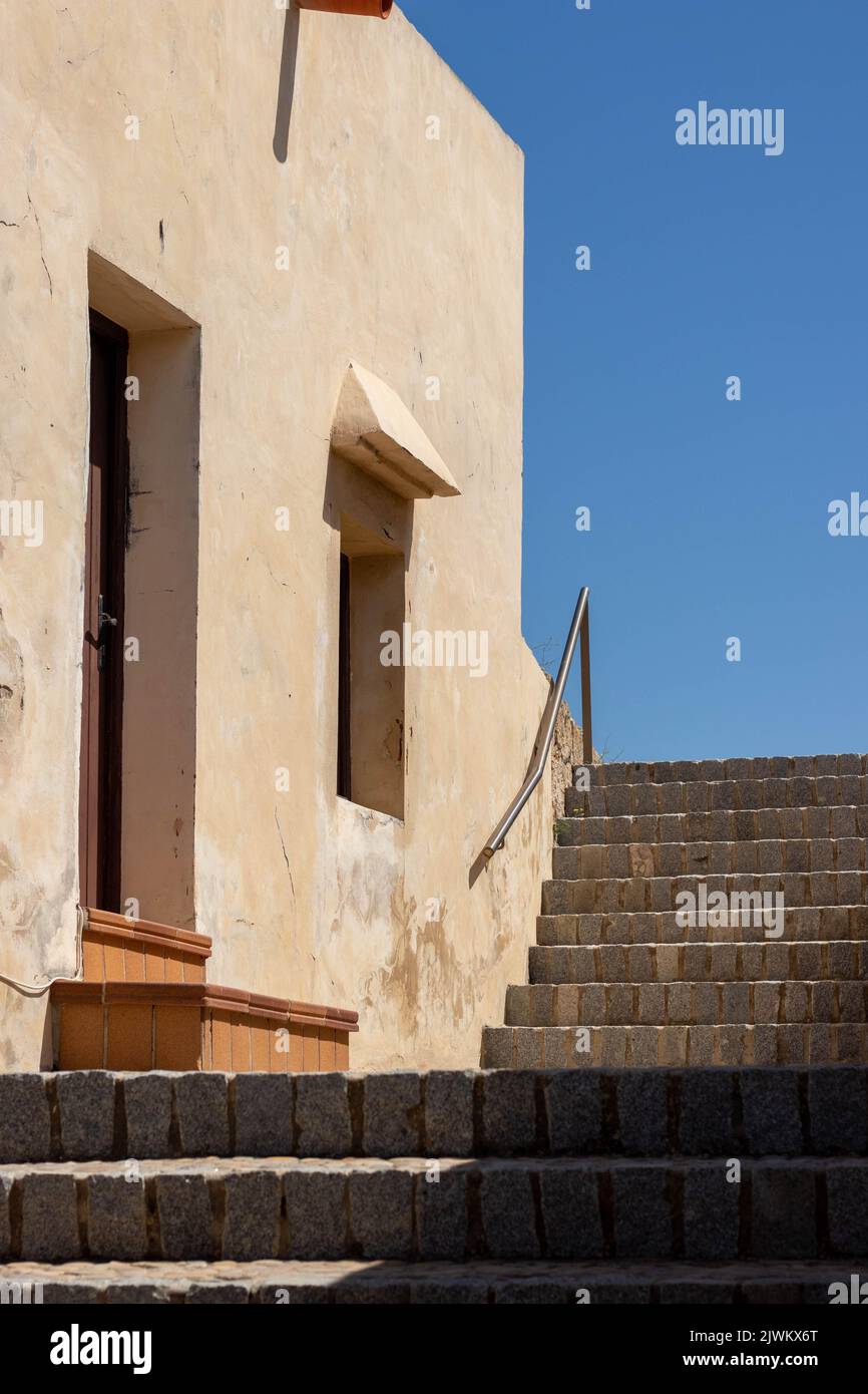Vertical view of beige and neutral color building in a staircase in ...