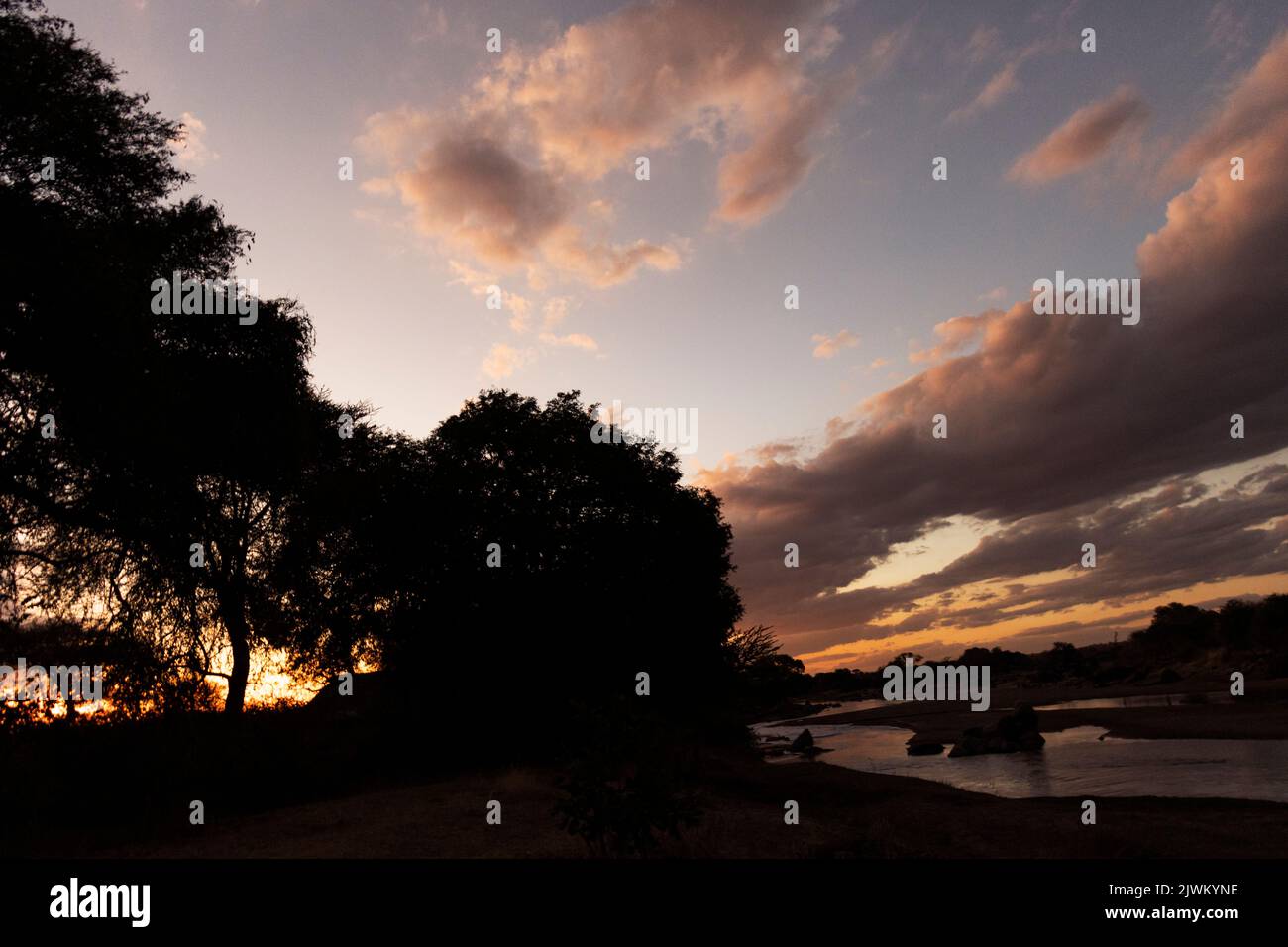 Dusk settles over the Great Ruaha River at the site of Ruaha River Camp ...
