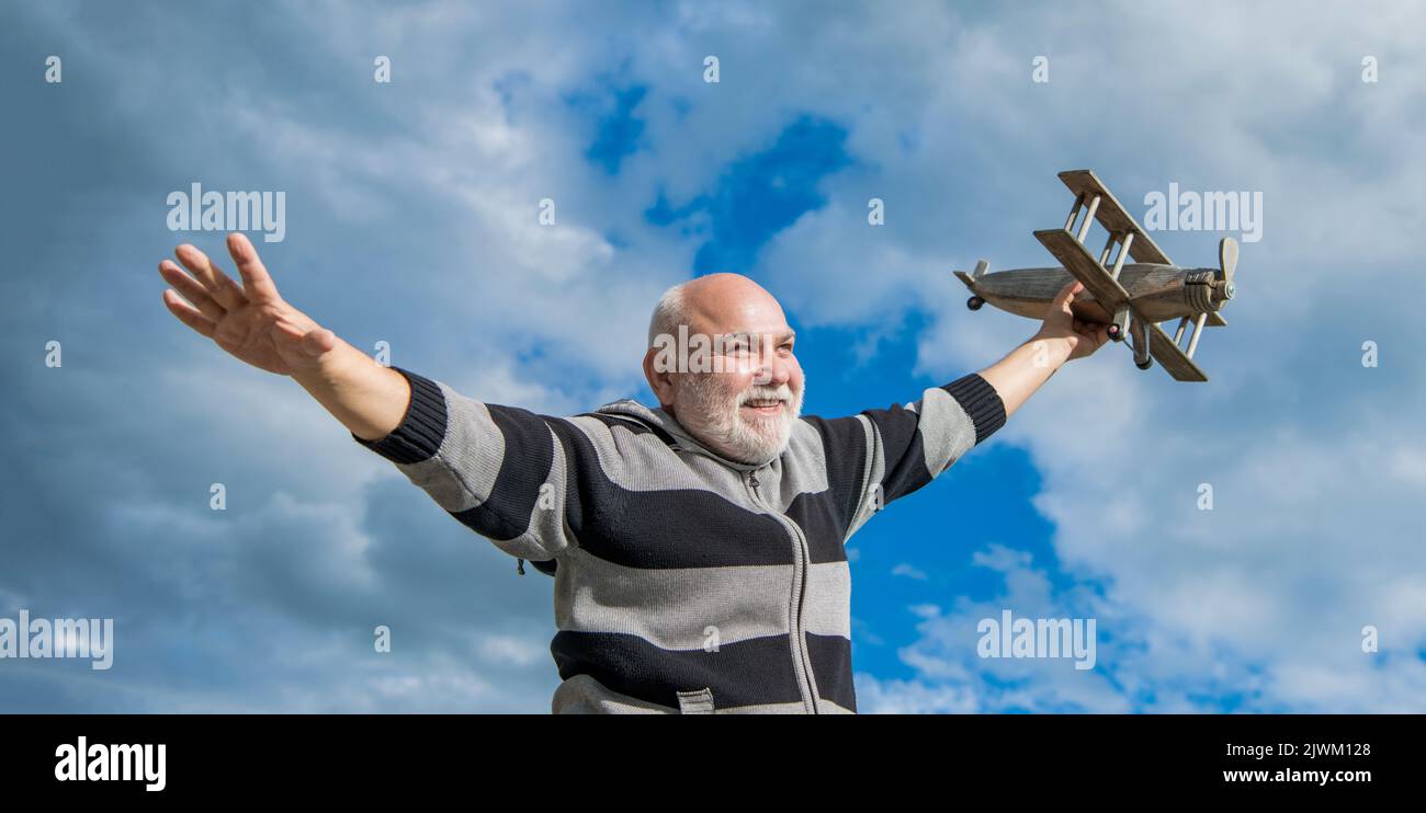happy retirement. cheerful granddad with toy. retired old man outdoor ...