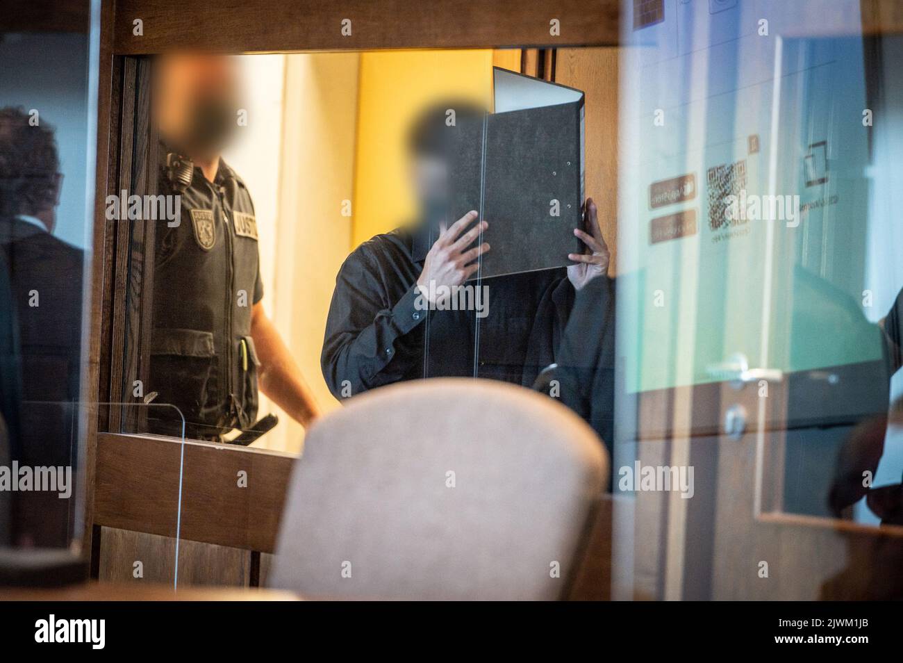 Cologne, Germany. 06th Sep, 2022. The defendant is led into the ...