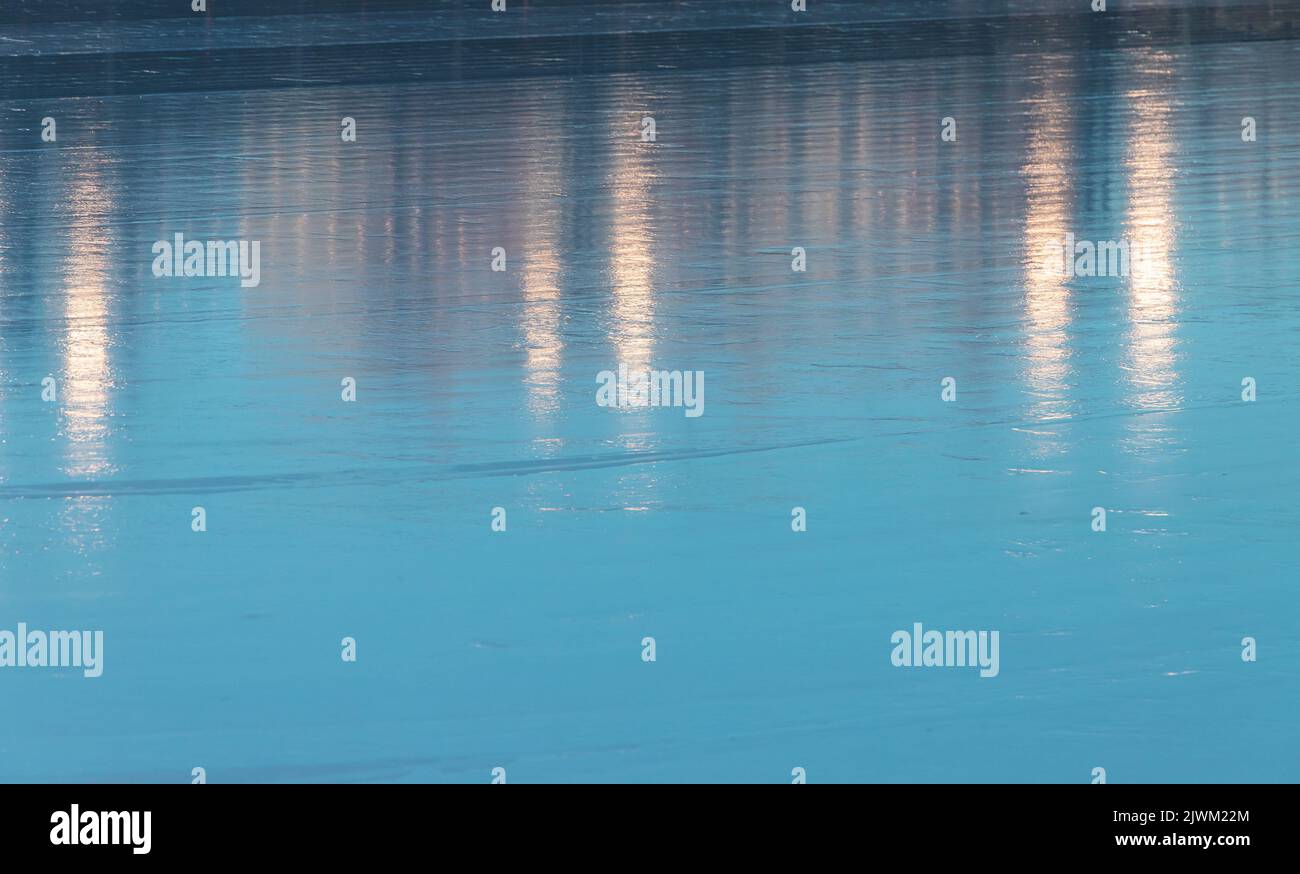 Blue ice rink surface with reflections, abstract skating background ...