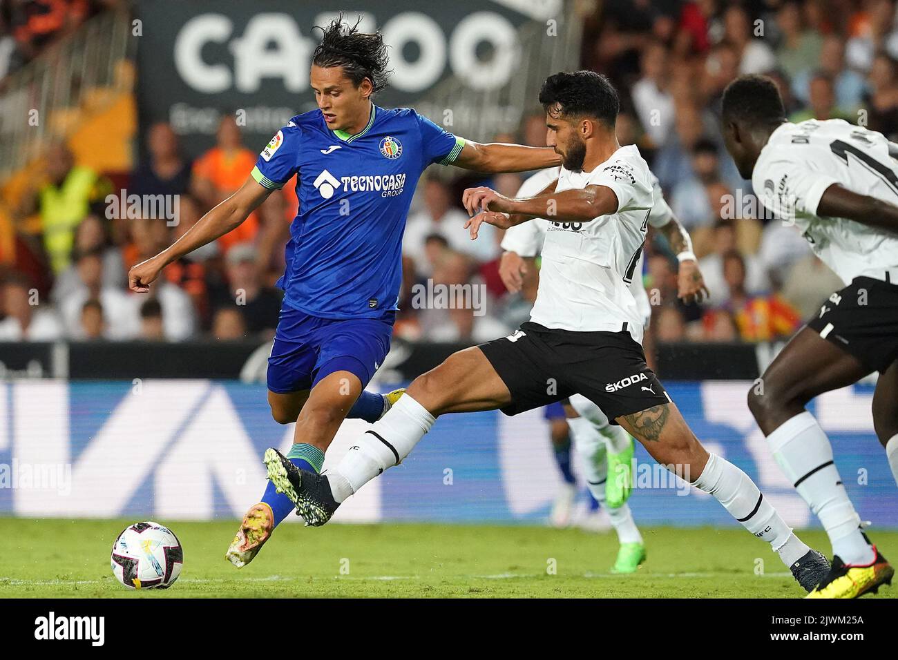 Valencia CF's Eray Comert (r) and Getafe CF's Enes Unal during La Liga match. September 4, 2022 ...