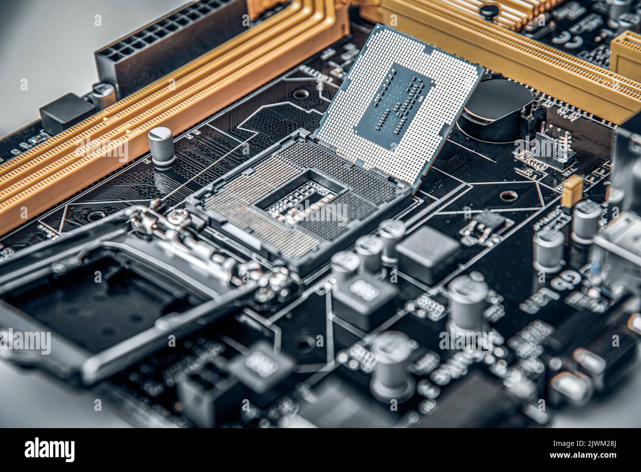 Installing central processor unit into computer motherboard Stock Photo - Alamy