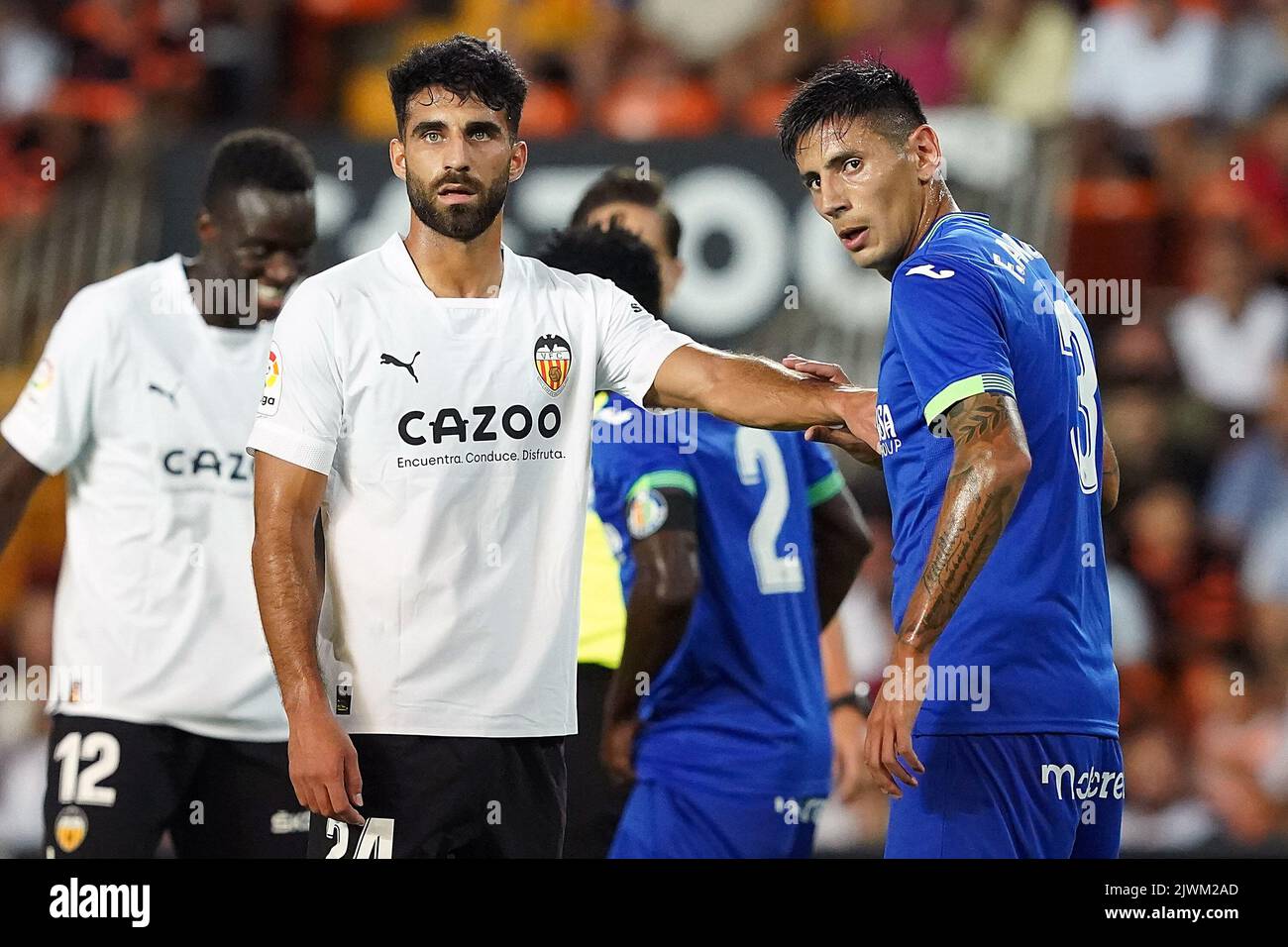 Valencia CF's Eray Comert (l) and Getafe CF's Fabrizio Angileri during La Liga match. September ...