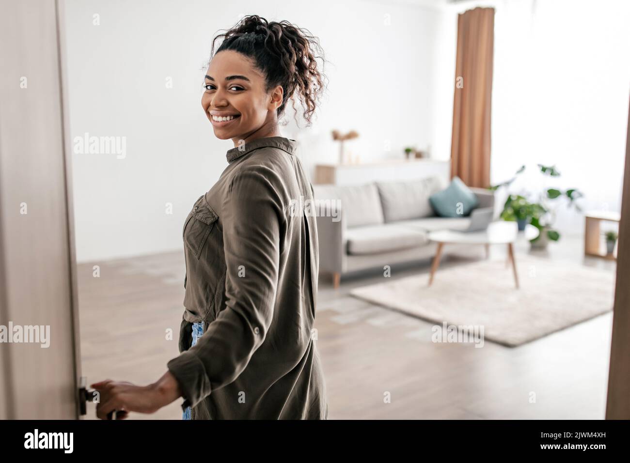 Cheerful Black Female Opening Entry Door Entering Apartment Stock Photo ...