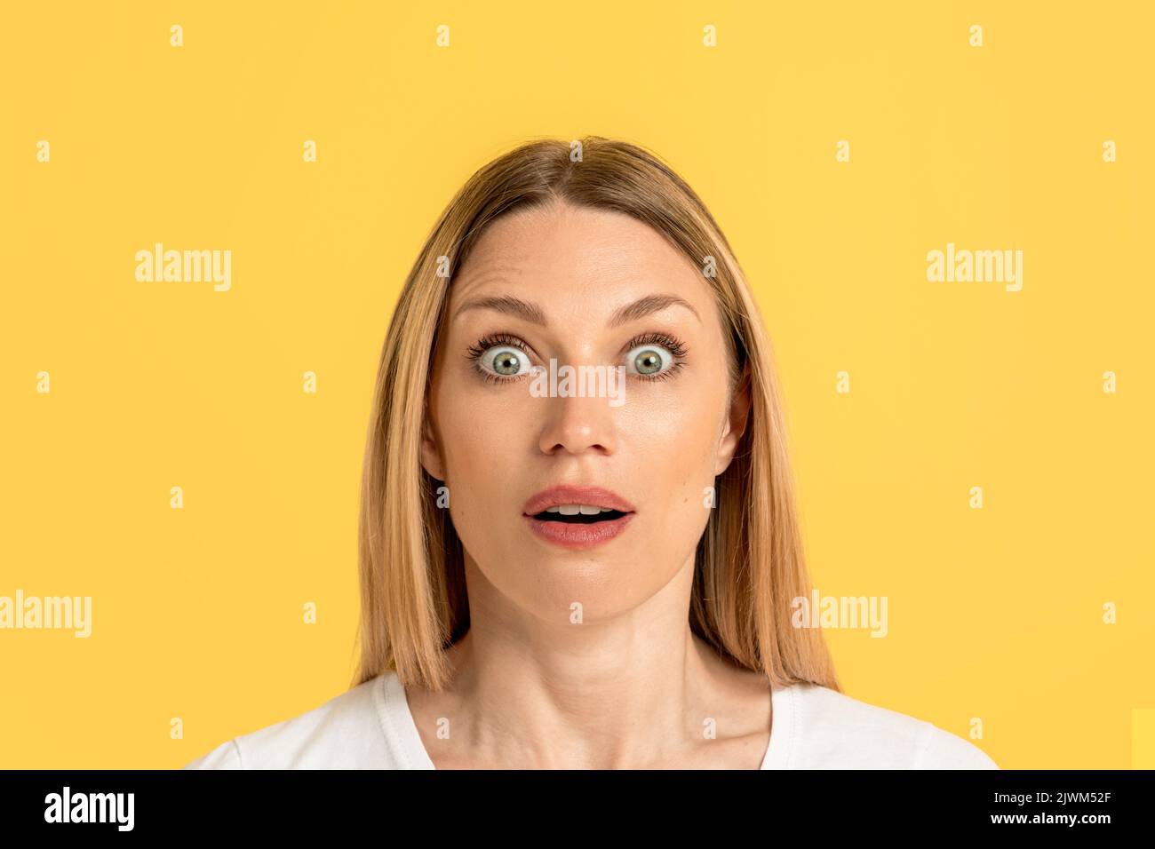 Cheerful surprised millennial caucasian blonde lady with open mouth in ...