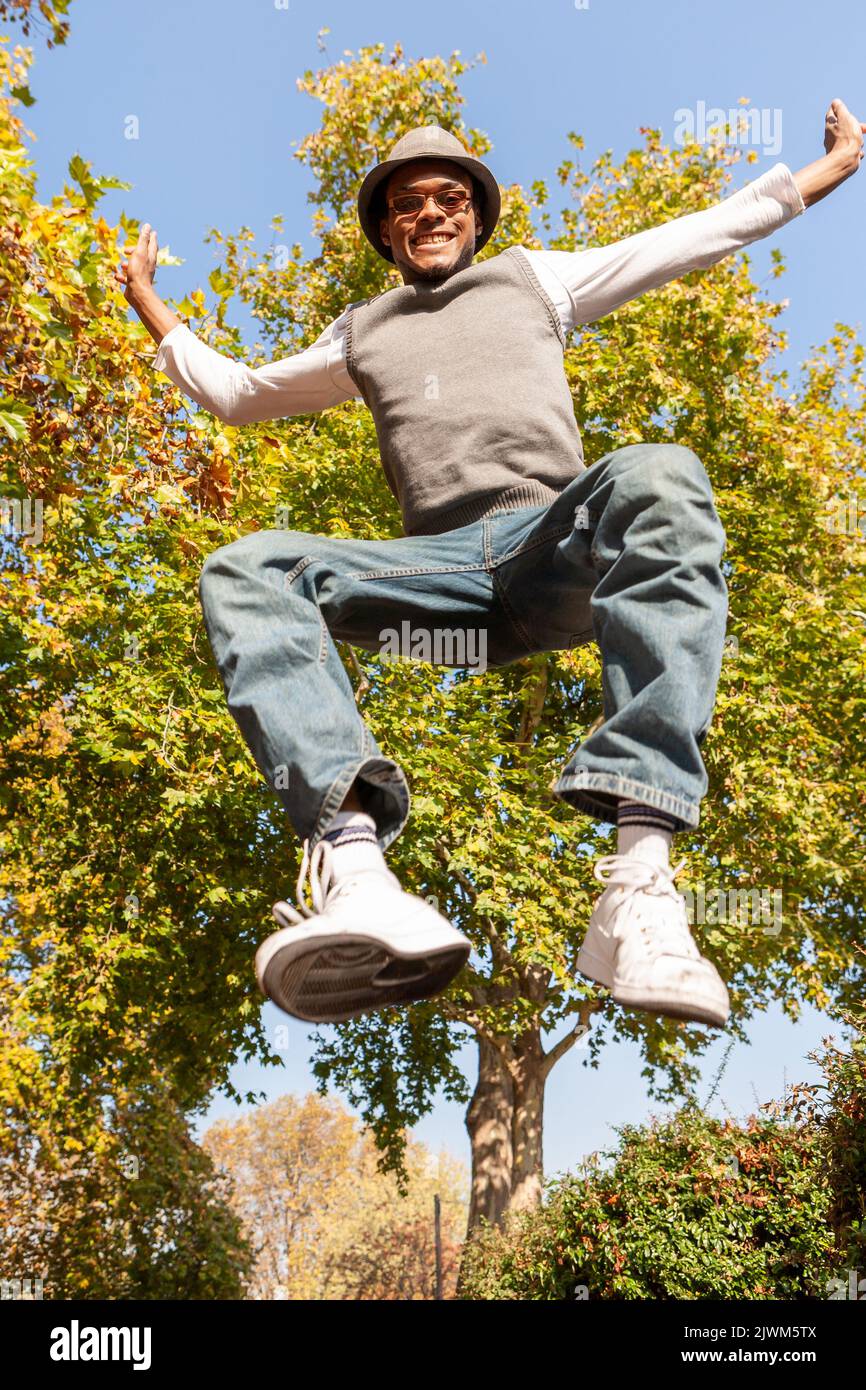 Teenage Students: Jumping for Joy. A carefree moment during recess for ...