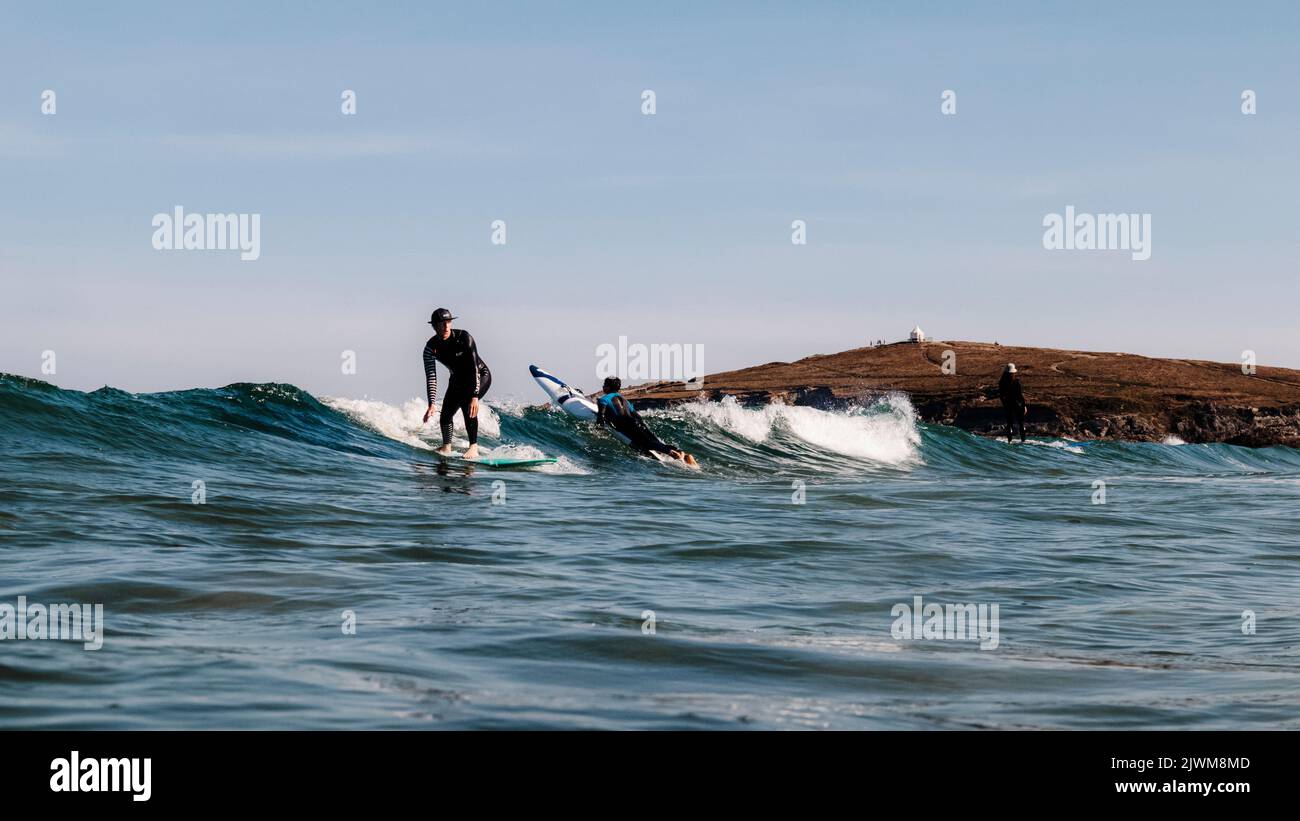 people surfing in Cornwall summer fun in the UK beginners to ...
