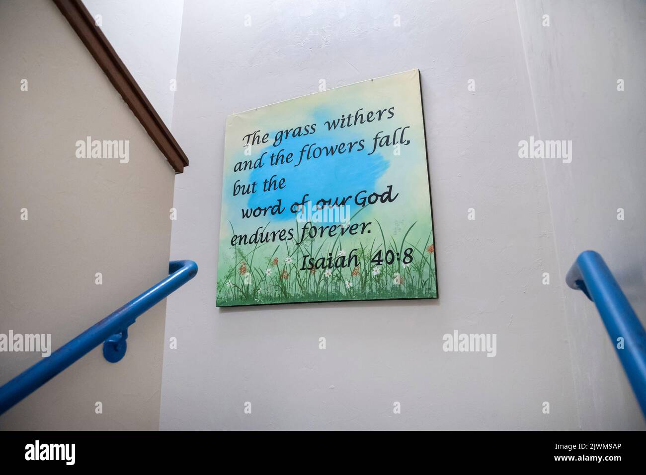 Artwork with a Christian theme decorates a stairwell in a church in ...
