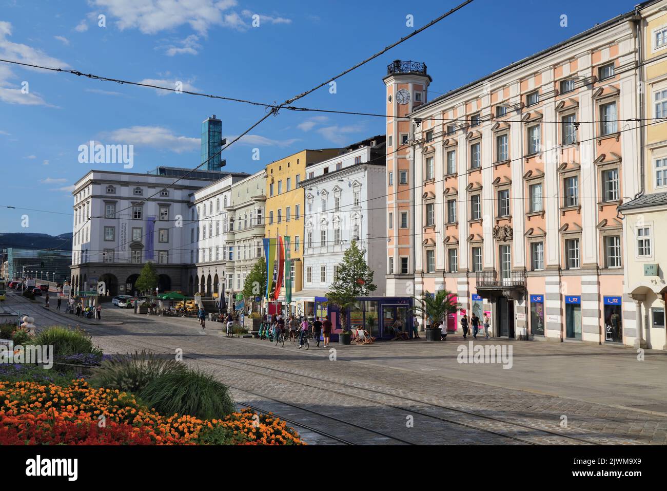 LINZ, AUSTRIA - AUGUST 1, 2022: People visit the main square Hauptplatz ...
