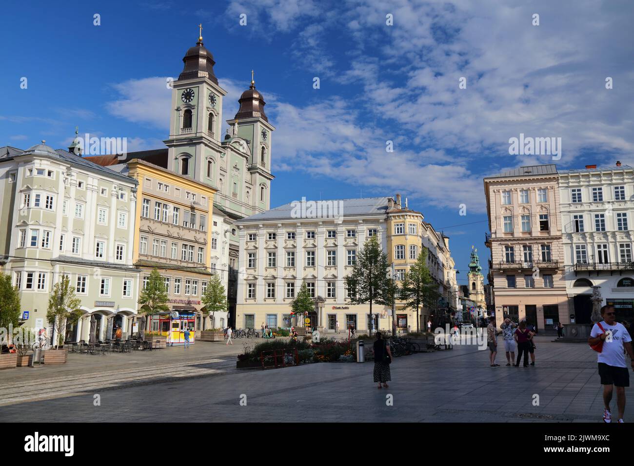 LINZ, AUSTRIA - AUGUST 1, 2022: People visit the main square Hauptplatz ...