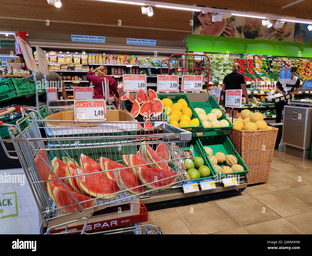 VIENNA, AUSTRIA - AUGUST 8, 2022: People visit fruit section in Spar ...