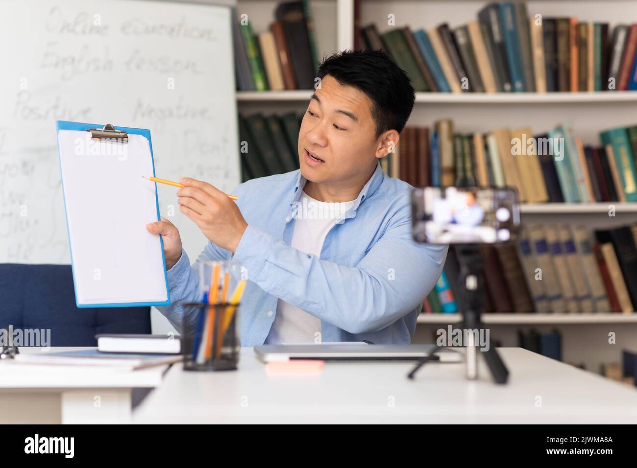 Japanese Teacher Having Virtual Lecture Via Video Call At Workplace ...