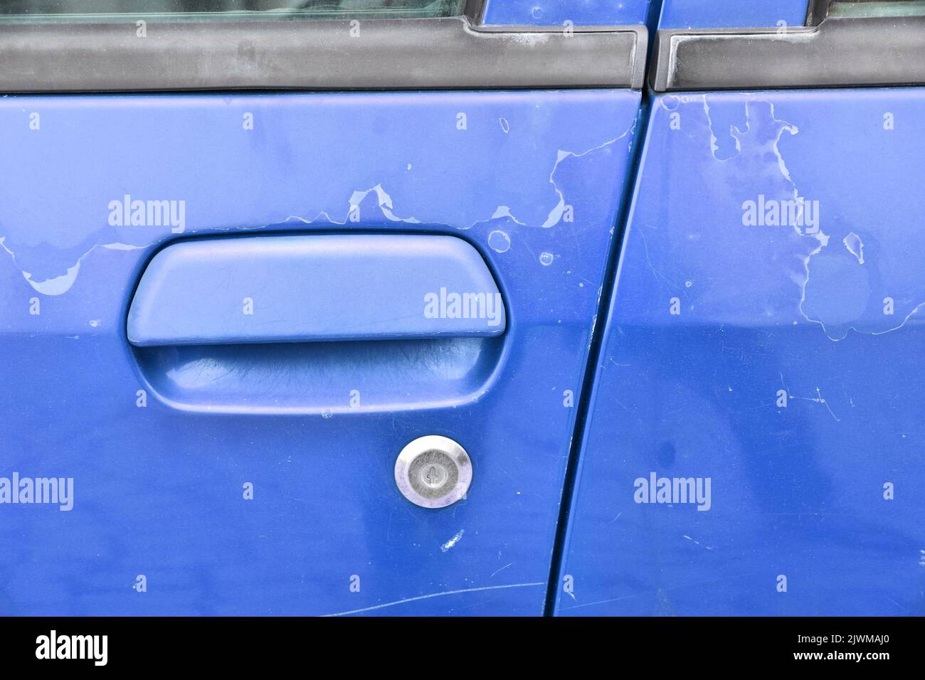 Aged car paint - peeling paint surface in a 20 year old European red ...