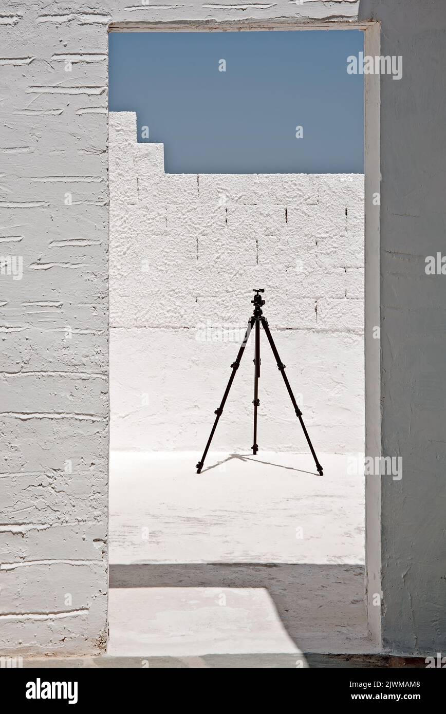 The white terrace decorated with black tripod Stock Photo - Alamy