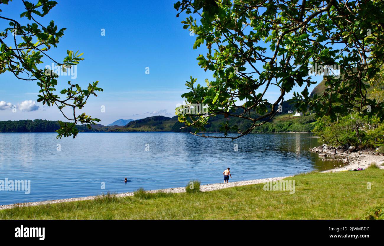LOCH MORAR LOCHABER SCOTLAND LATE SUMMER A SWIMMER IN THE LOCH Stock ...