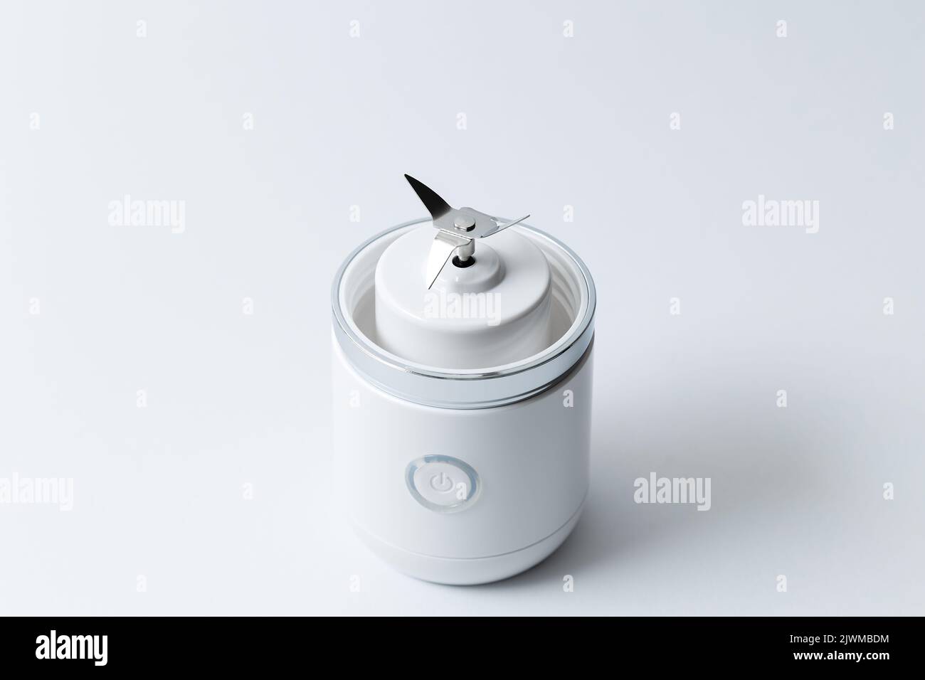 Close up of stainless steel blades of portable mini blender for making ...