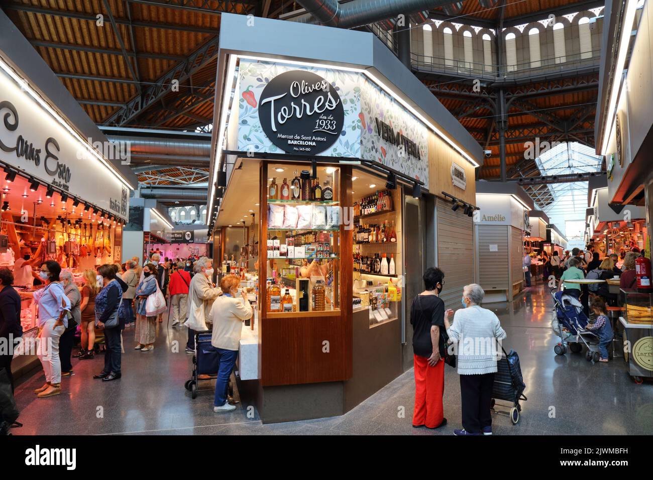 BARCELONA, SPAIN - OCTOBER 8, 2021: People visit local market hall ...