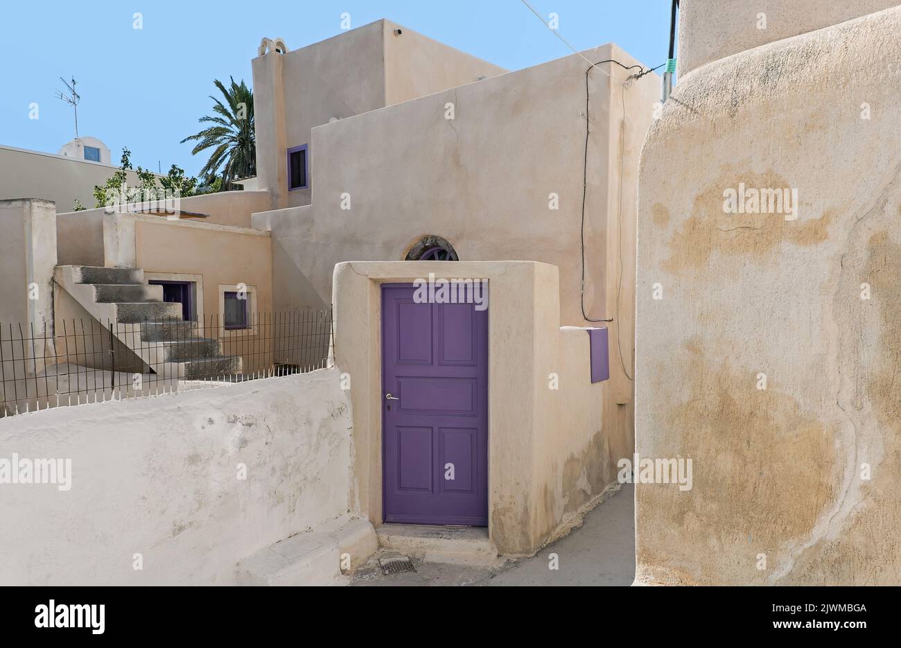 Violet door architecture of Emporio, Santorini, Greece Stock Photo - Alamy