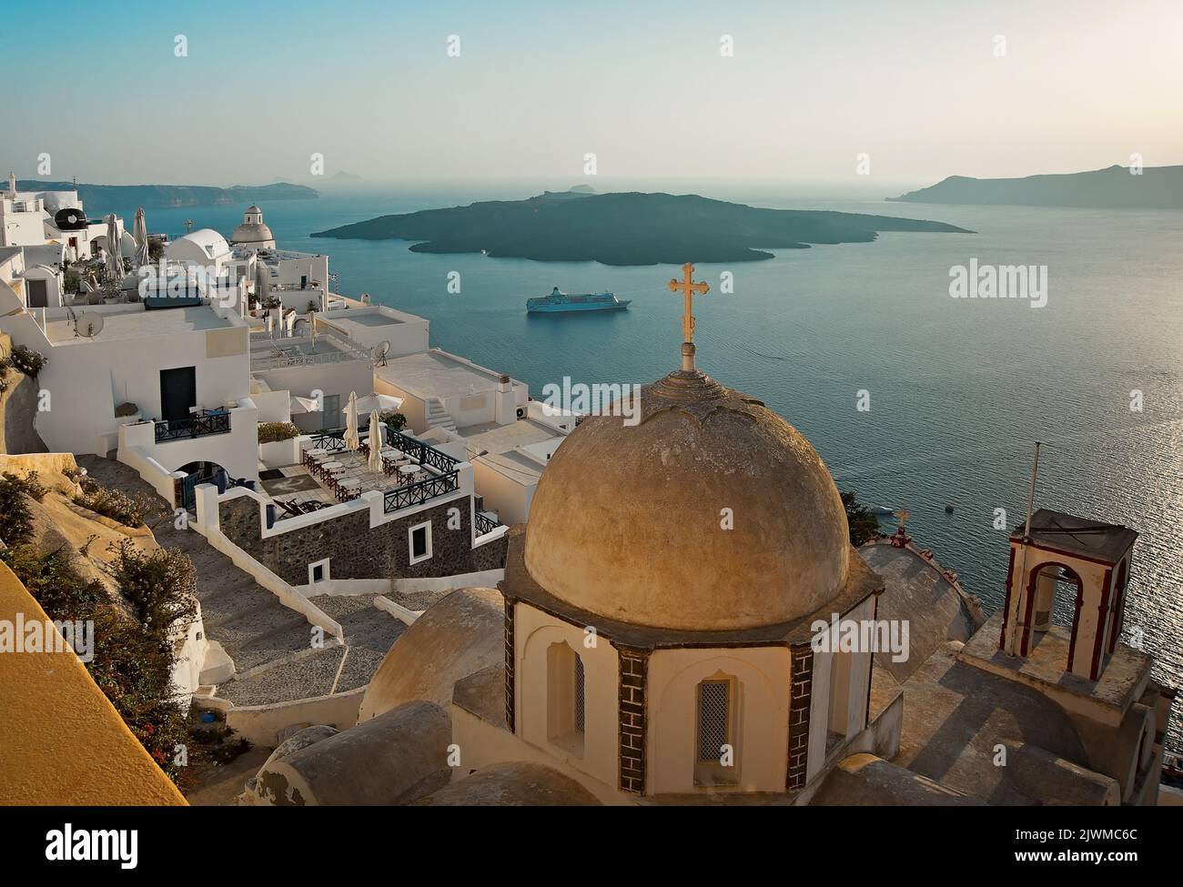 Fira panorama and church cupolas at sunset in Fira, Santorini Stock ...