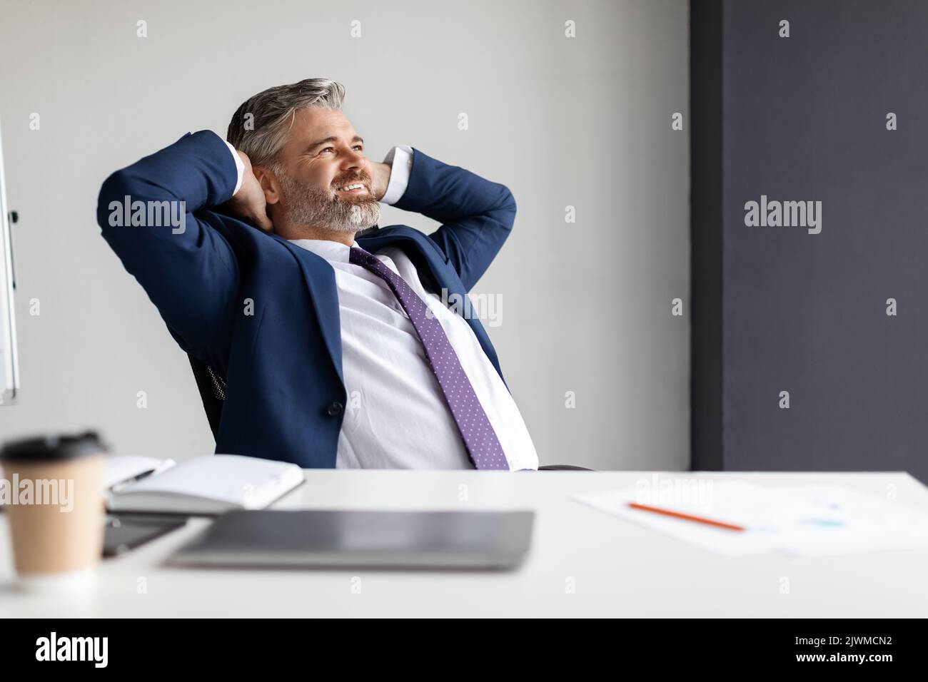 Businessman desk office leaning back hi-res stock photography and ...