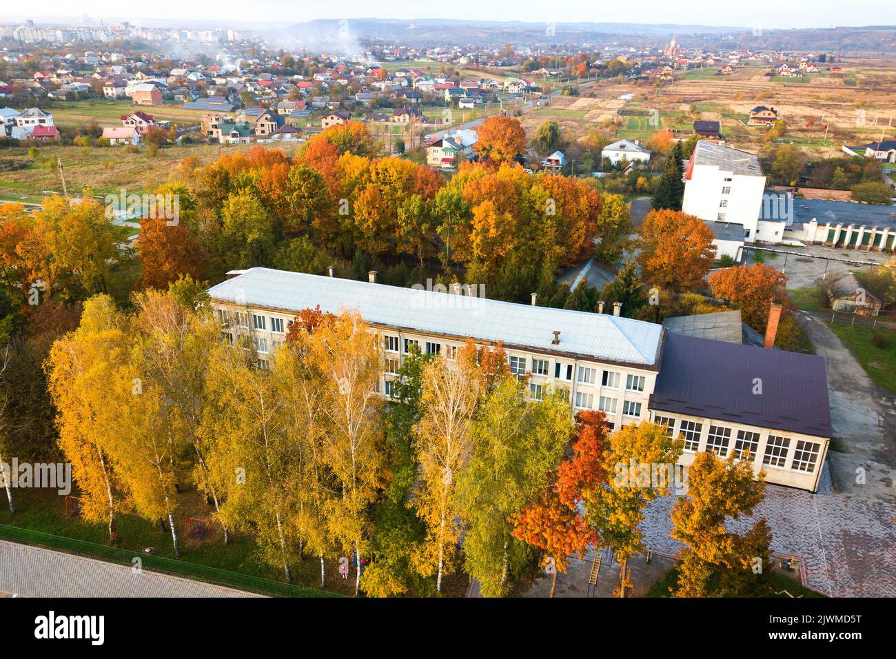 Aerial view of school, college or kindergarten building with big yard ...