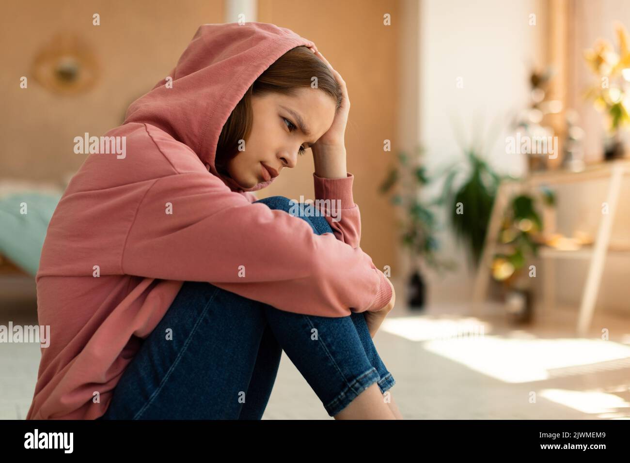 Portrait of upset teen girl feeling upset and depressed, looking away ...