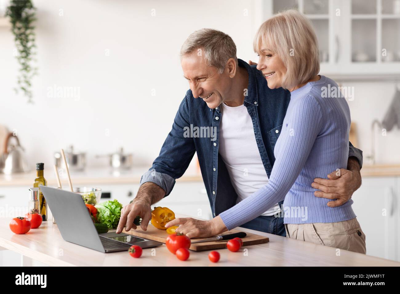 Video happy caucasian couple cooking hi-res stock photography and ...