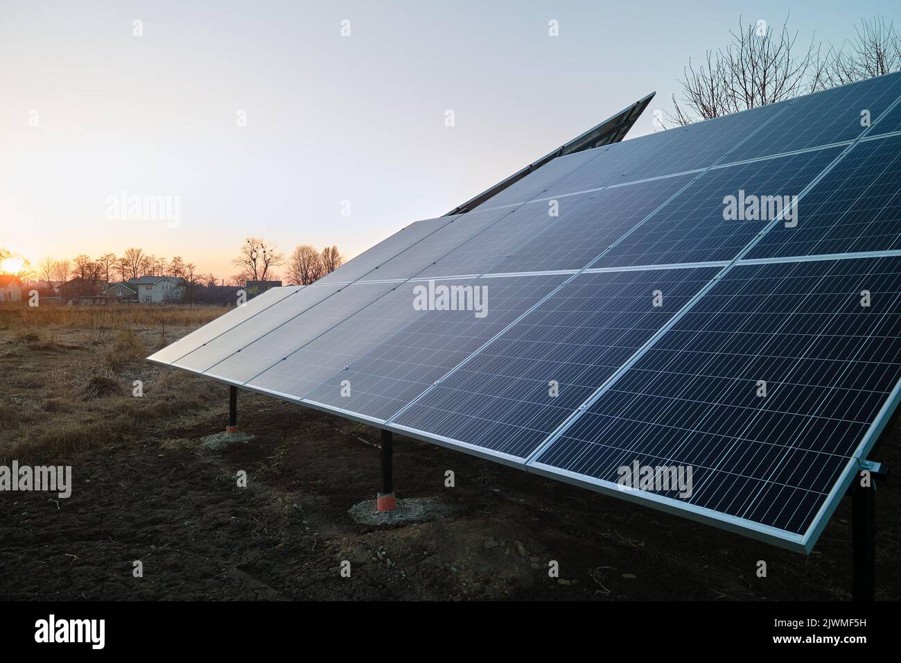 Solar photovoltaic panels mounted on stand-alone frame on backyard ...