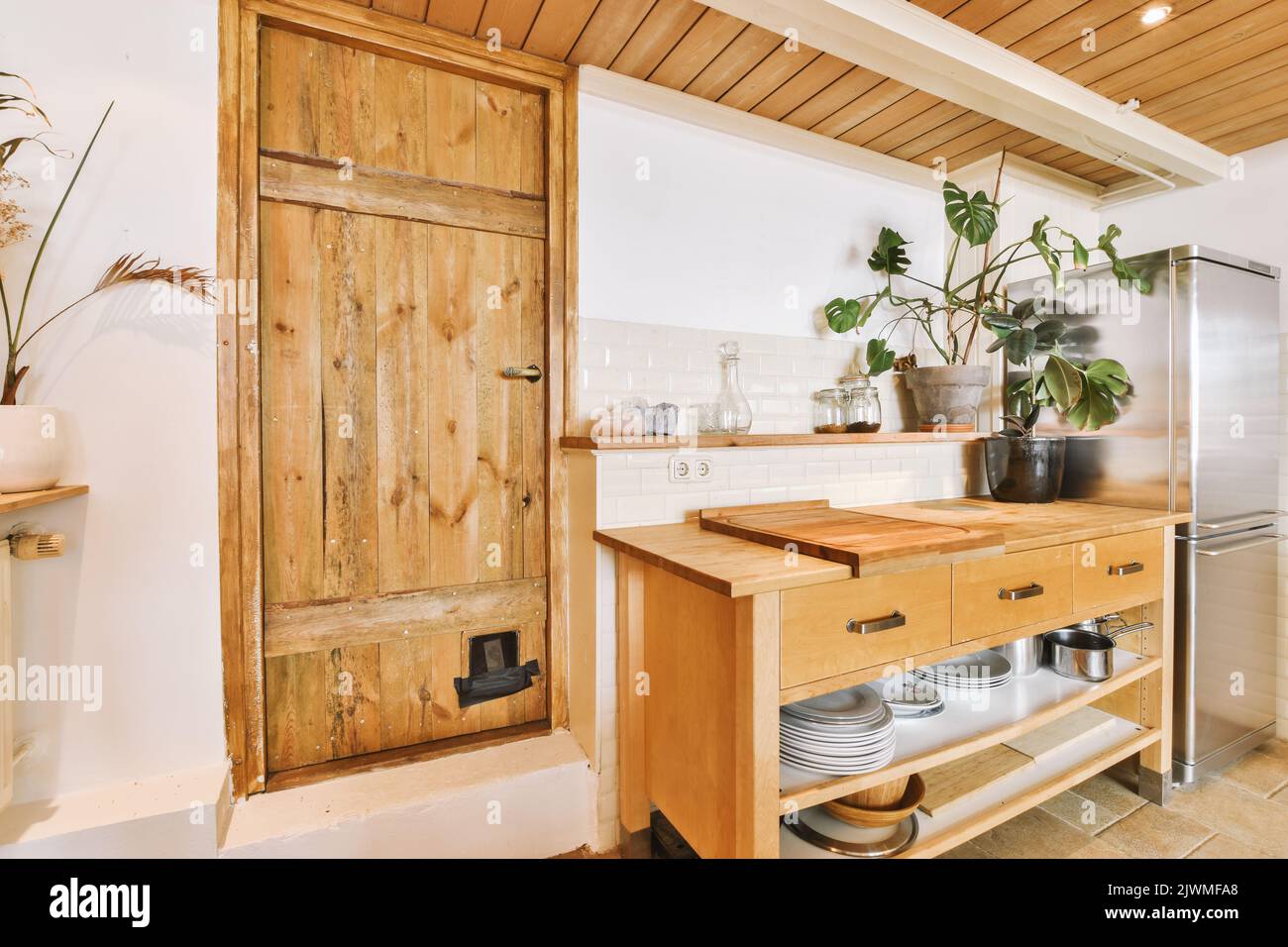 Interior of light kitchen and dining room at daytime Stock Photo - Alamy