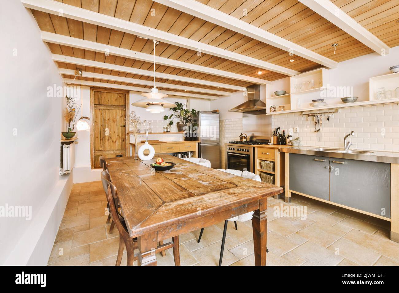 Interior of light kitchen and dining room at daytime Stock Photo - Alamy