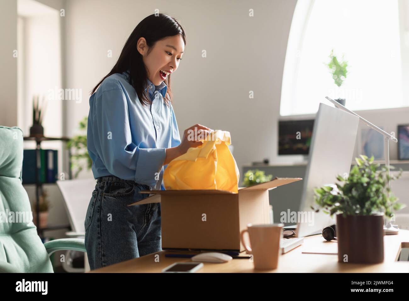 Joyful Korean Female Unpacking Box Receiving Delivered Parcel At Home ...
