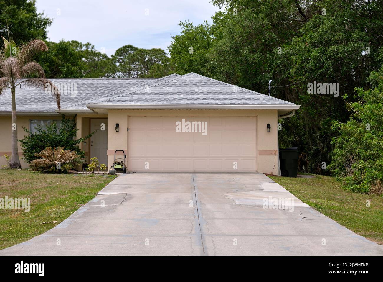 Wide garage double door and concrete driveway of new modern american ...