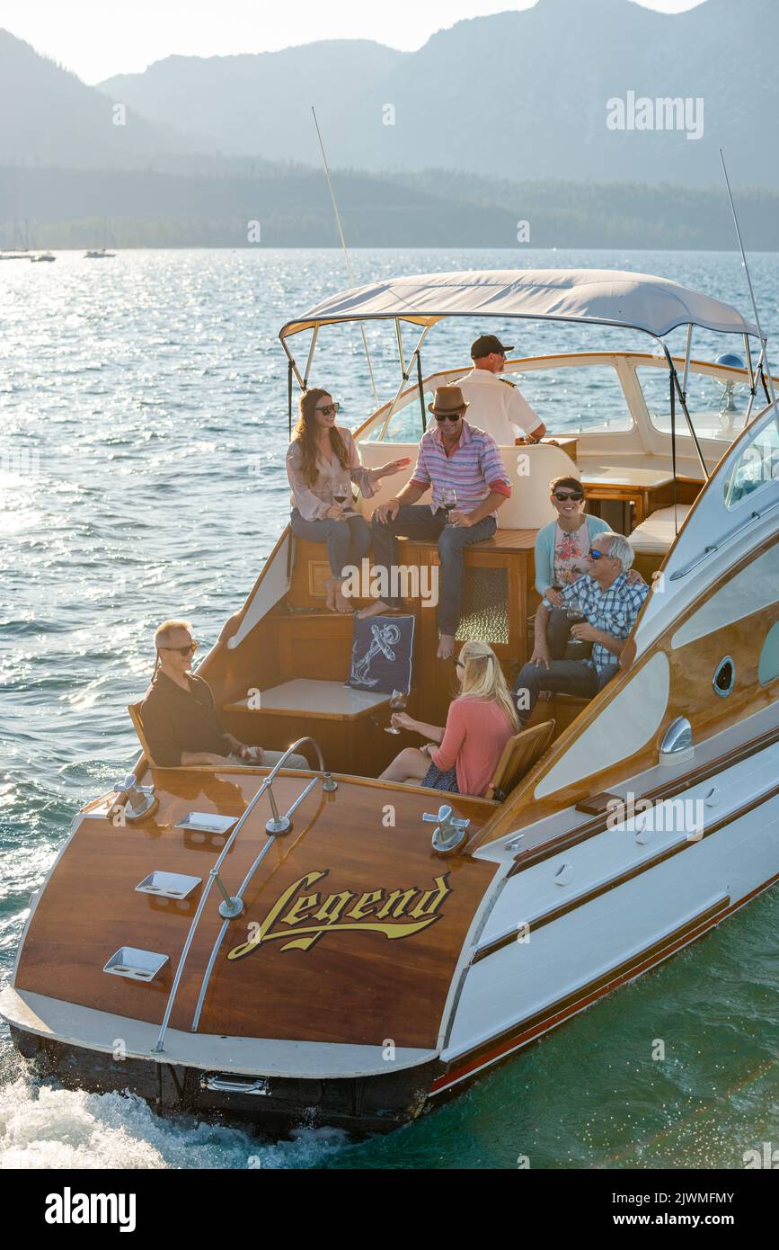 A group of friends cruise on a yacht in South Lake Tahoe, California ...