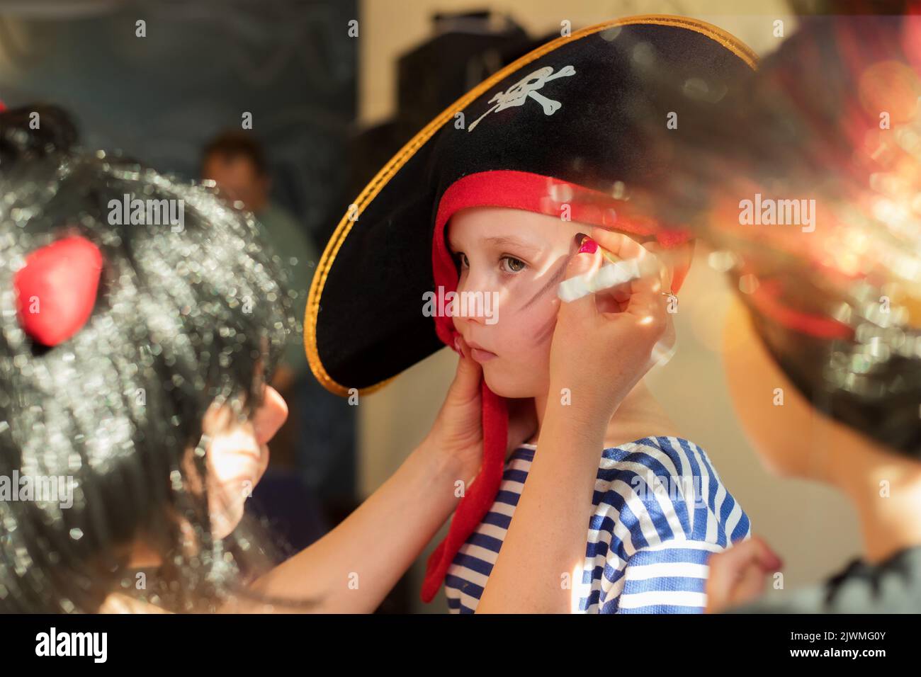 animator draws cobwebs on boy's face on halloween Stock Photo - Alamy