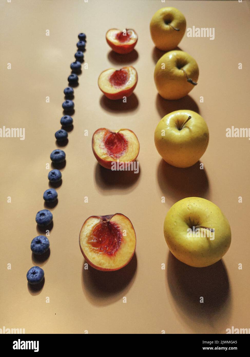 Apples, peaches and berries - symmetry Stock Photo - Alamy