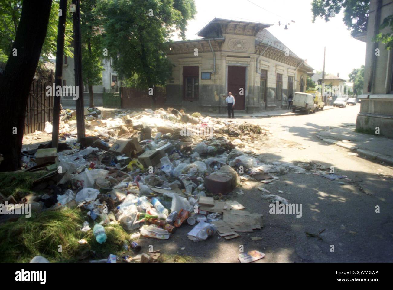 Bucharest, Romania, cca 1992. Piles of trash on a neighborhood street ...
