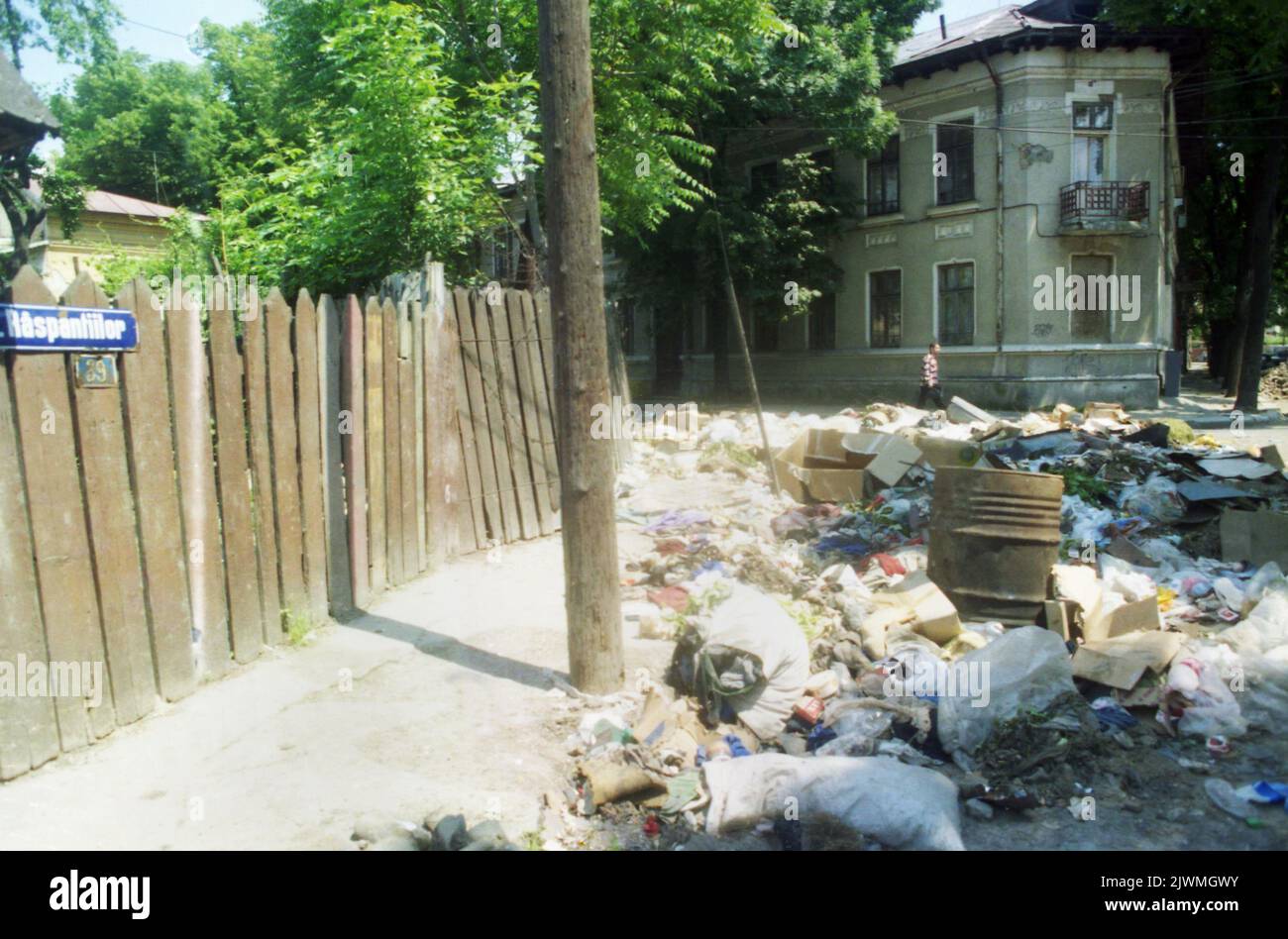 Bucharest, Romania, cca 1992. Piles of trash on a neighborhood street ...