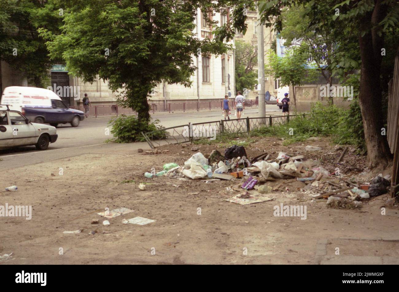 Bucharest, Romania, cca 1992. Piles of trash on a neighborhood street ...